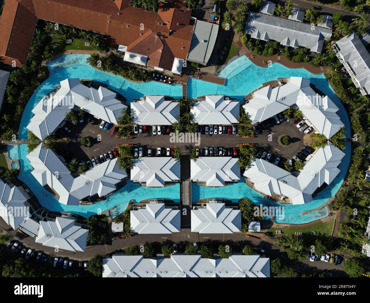 An aerial view of a stunning beach resort, featuring a luxurious ...