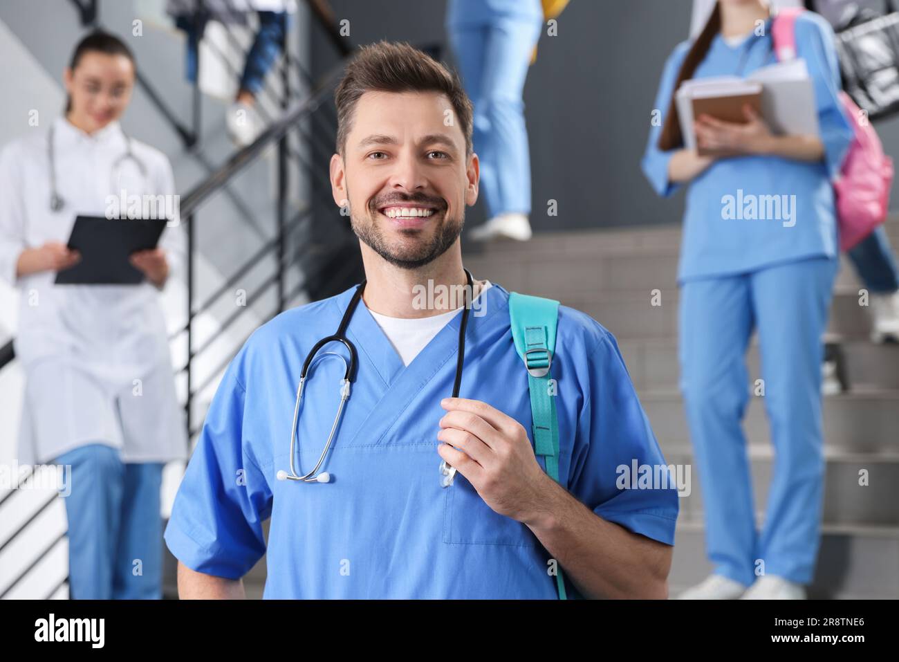 Portrait of medical student with stethoscope on staircase in college ...