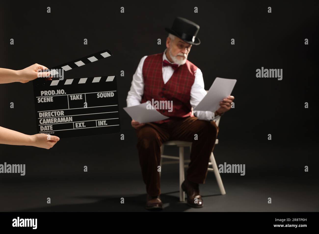 Senior actor performing role while second assistant camera holding ...