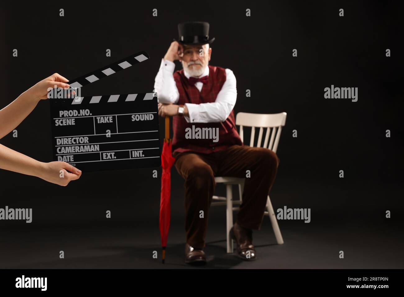 Senior actor performing role while second assistant camera holding ...