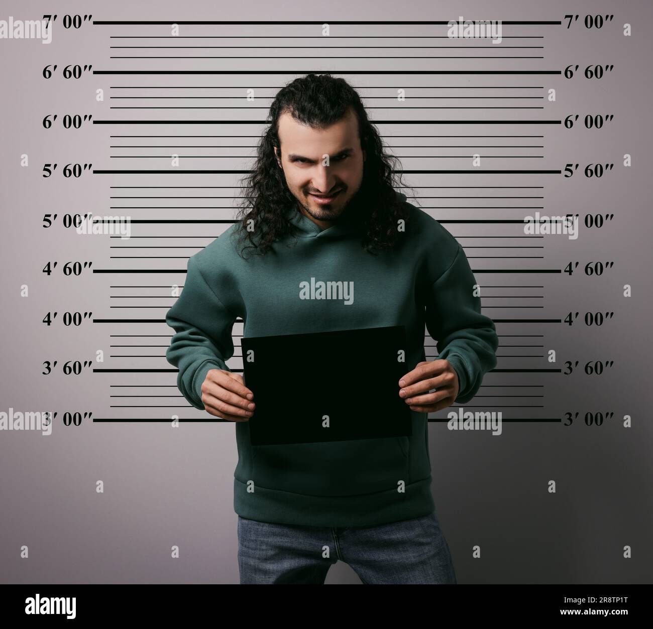 Criminal mugshot. Arrested man with blank card against height chart ...