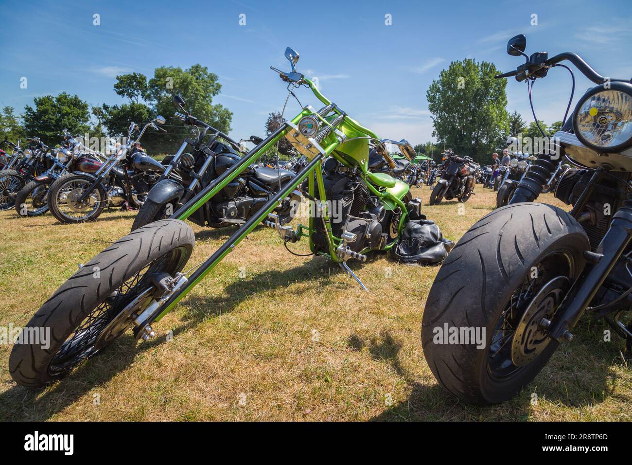 An eye catching chopper in line at a motorcycle rally. The chopper is ...
