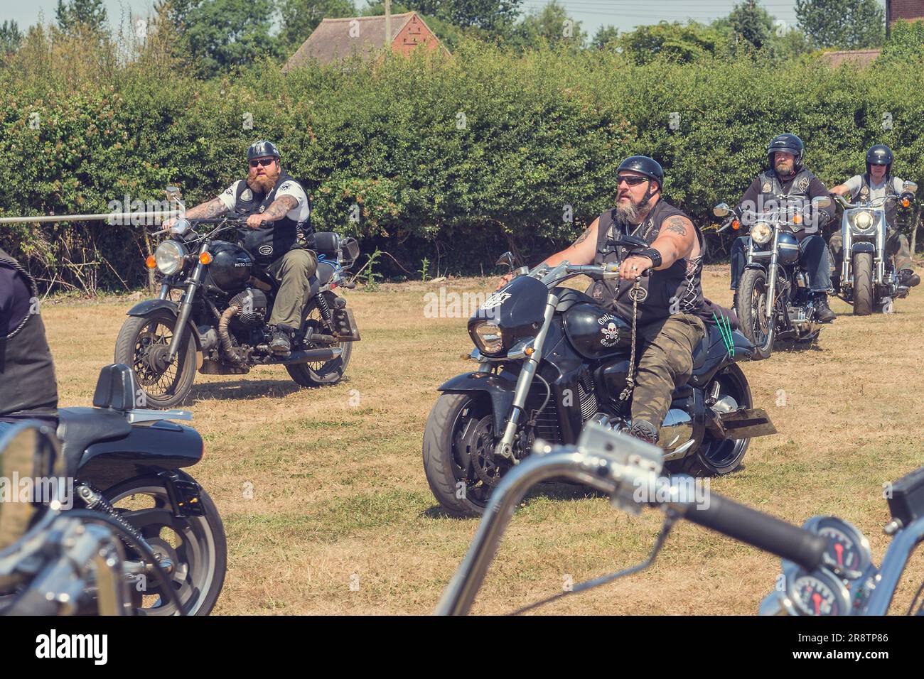 Members of The Outlaws Motorcycle Club arriving at a motorcycle rally ...