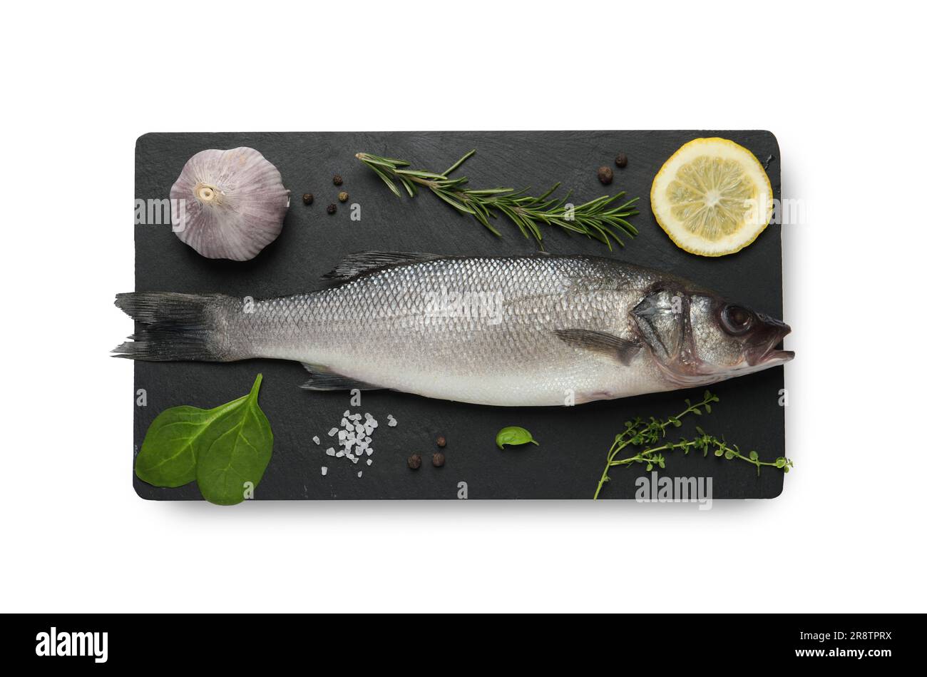 Tasty sea bass fish and ingredients isolated on white, top view Stock ...