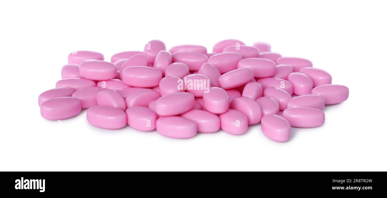 Tasty pink dragee candies on white background Stock Photo - Alamy