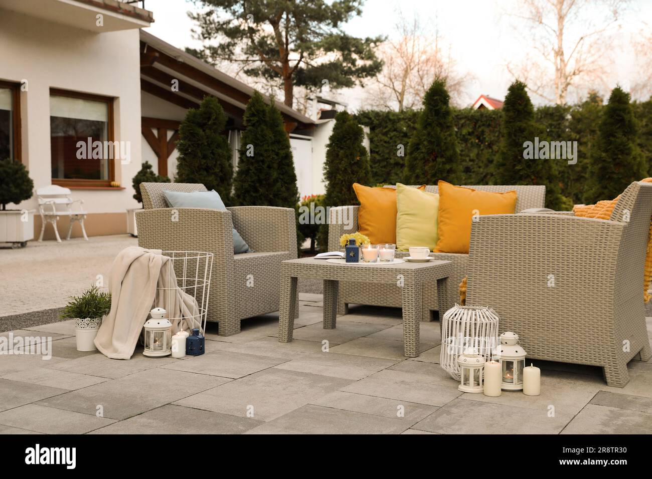 Beautiful rattan garden furniture, soft pillows and different decor ...