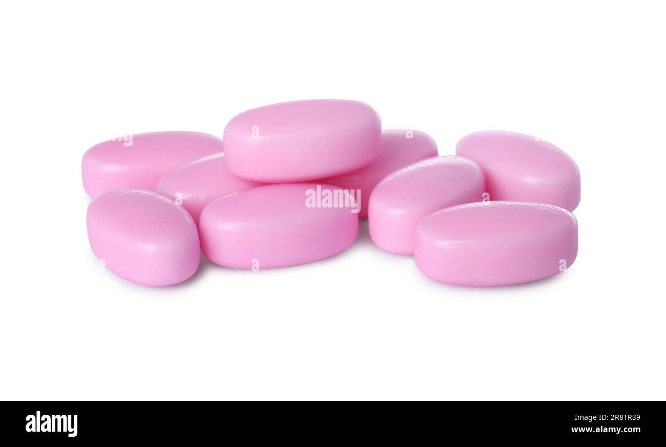 Tasty pink dragee candies on white background Stock Photo - Alamy