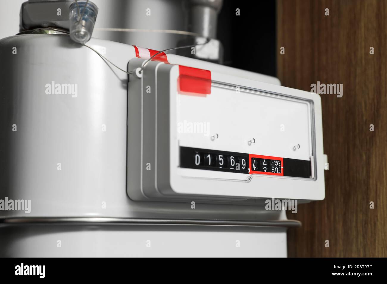 Electric meter near white wall, closeup. Gas measuring device Stock ...
