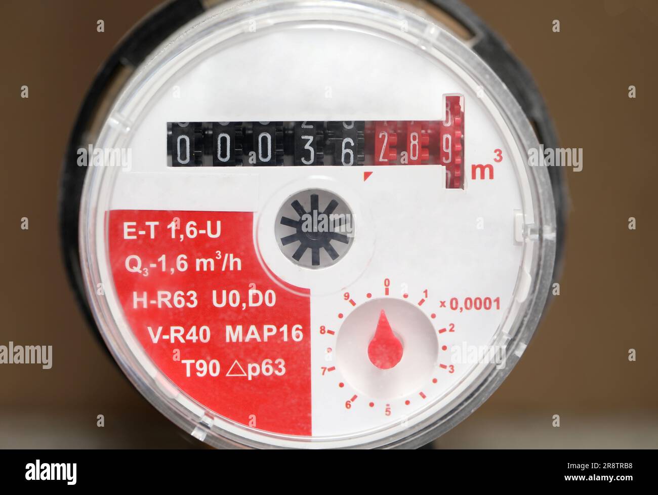 Electric meter on blurred background, closeup view. Water measuring ...