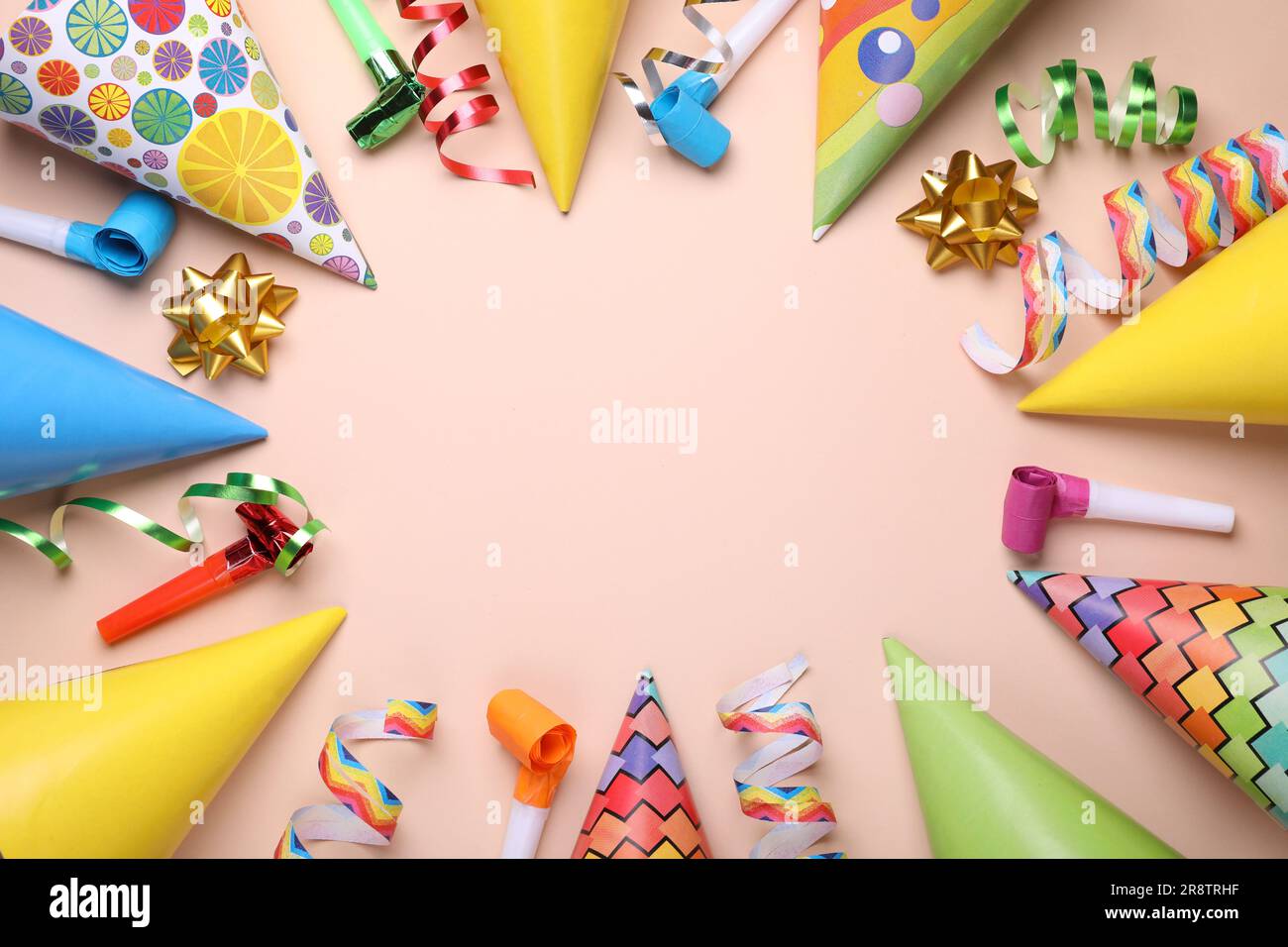Flat lay composition with party items on pale pink background, space ...