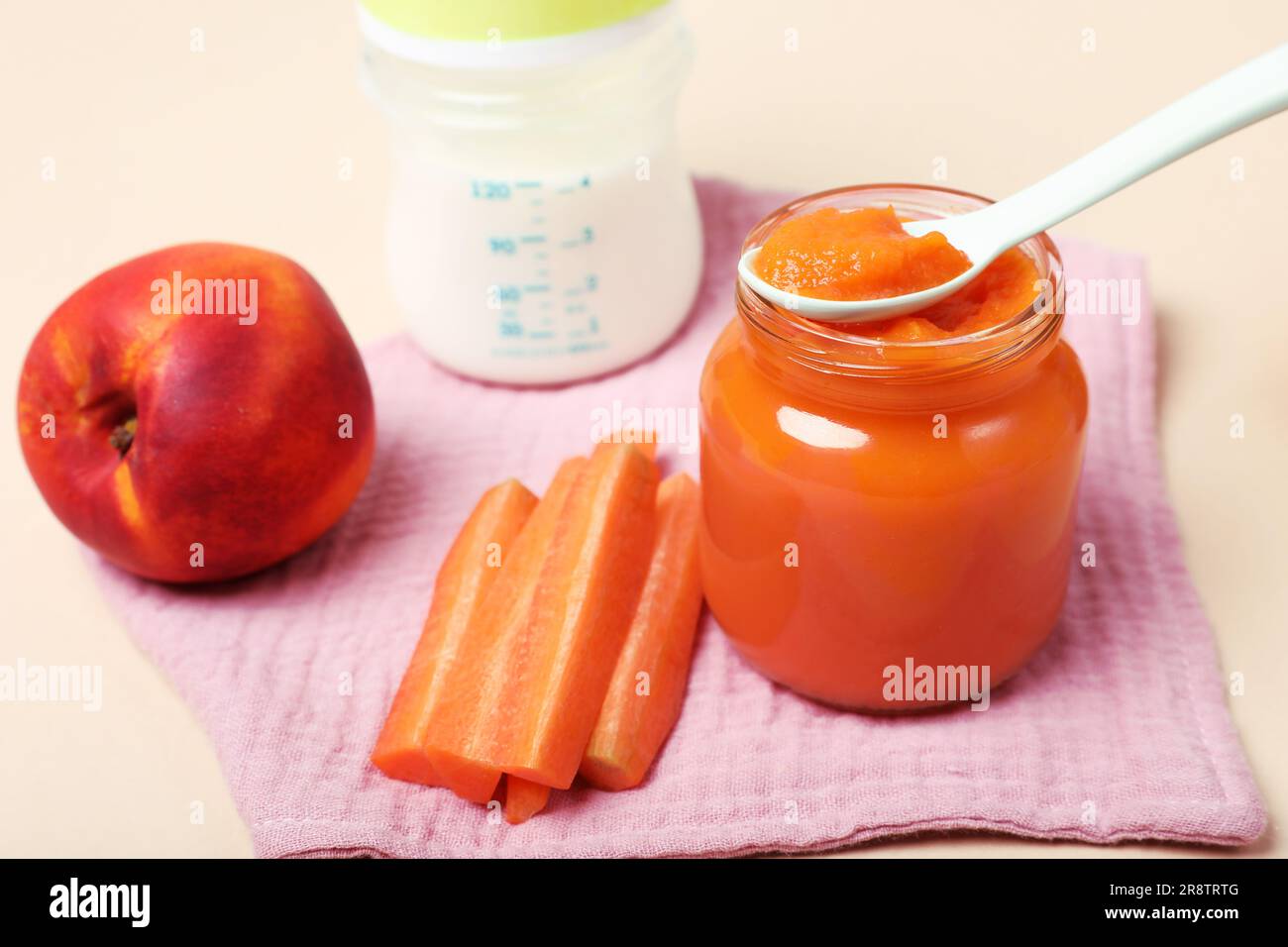 Healthy baby food and ingredients on pale pink background, closeup ...