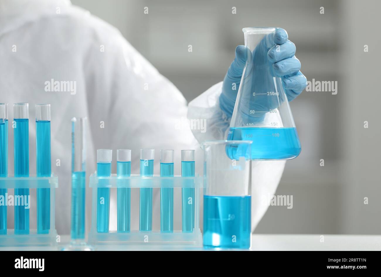 Scientist hand holding flask in hi-res stock photography and images - Alamy