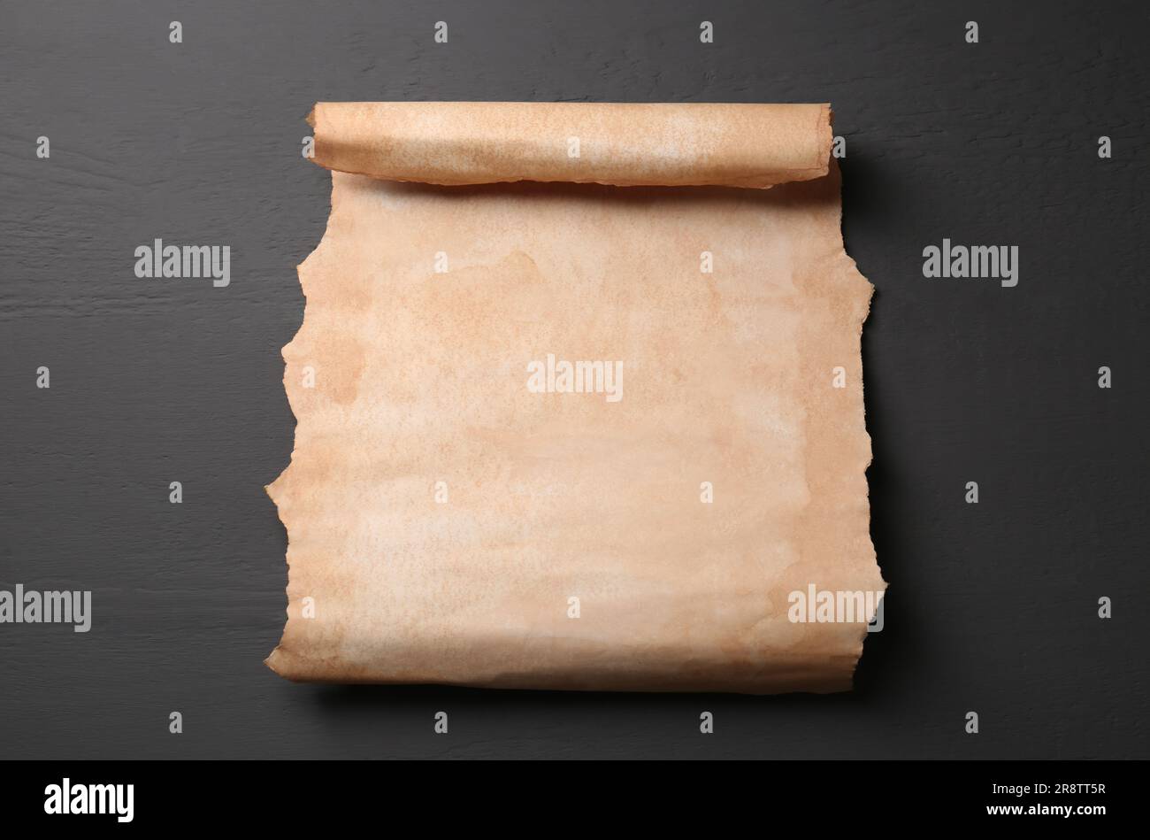 Sheet of old parchment paper on light grey wooden table, top view ...