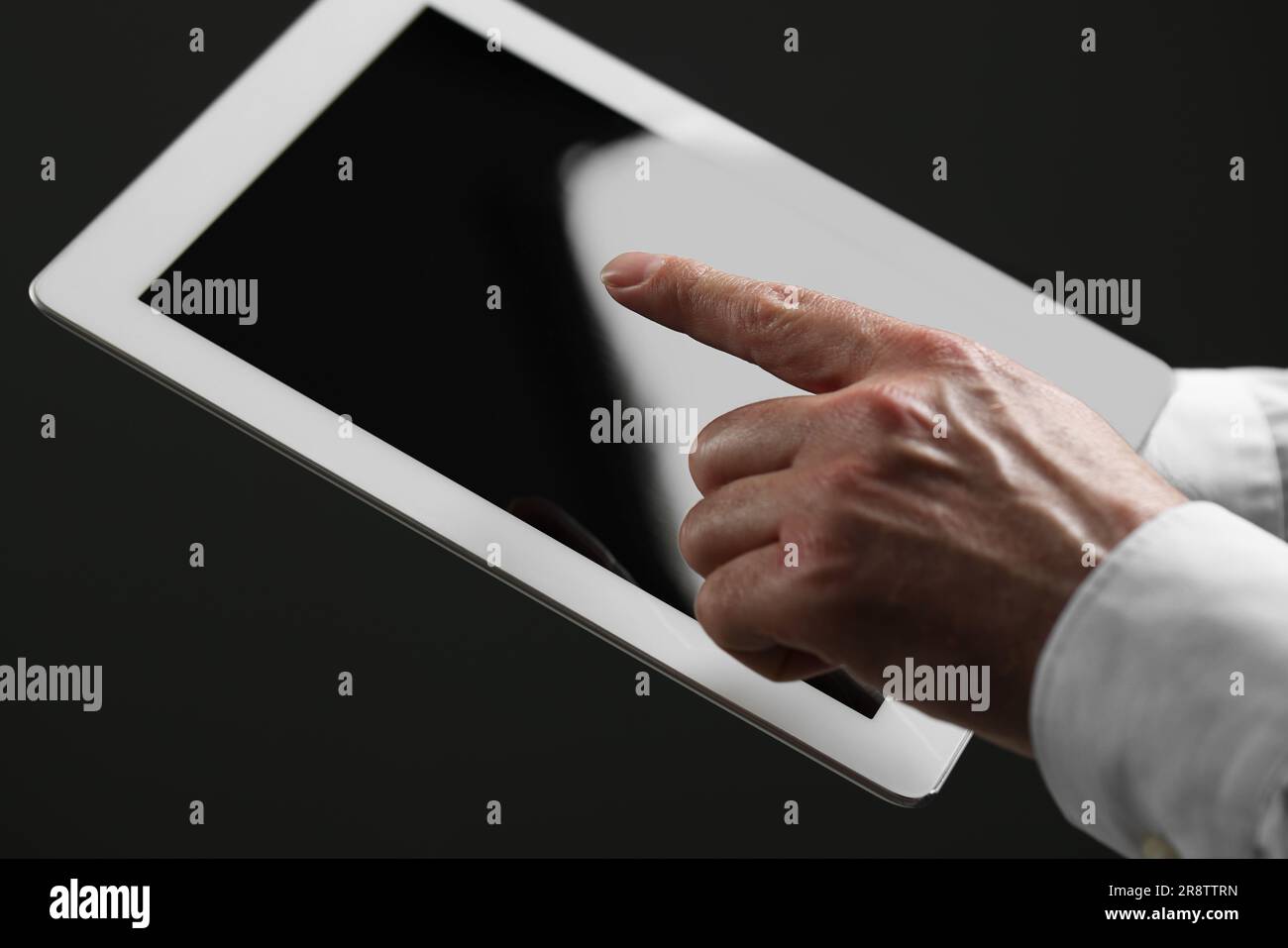 Closeup view of man using new tablet indoors Stock Photo - Alamy
