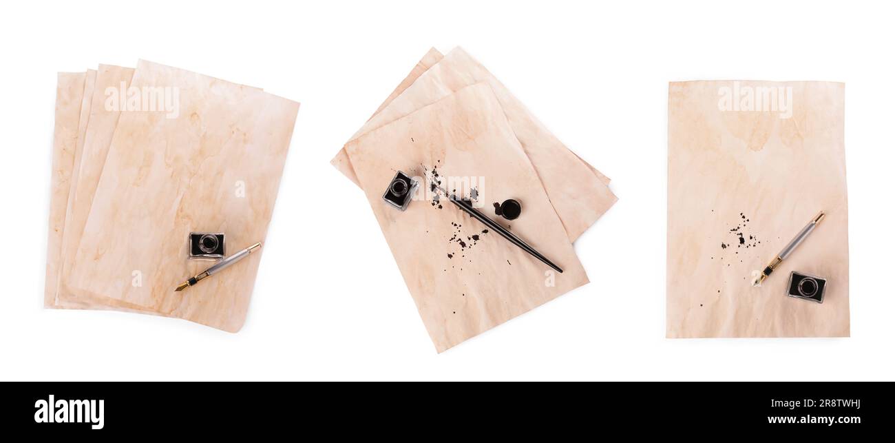 Many sheets of parchment, inkwell and different pens on white ...