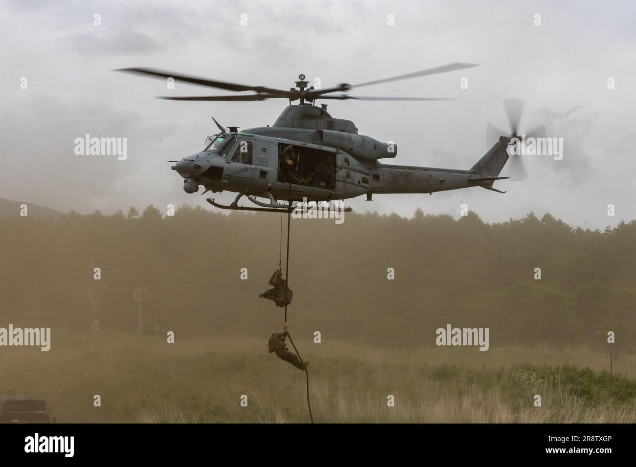 U.S. Marines with 3rd Reconnaissance Battalion fast rope from a UH-1Y ...