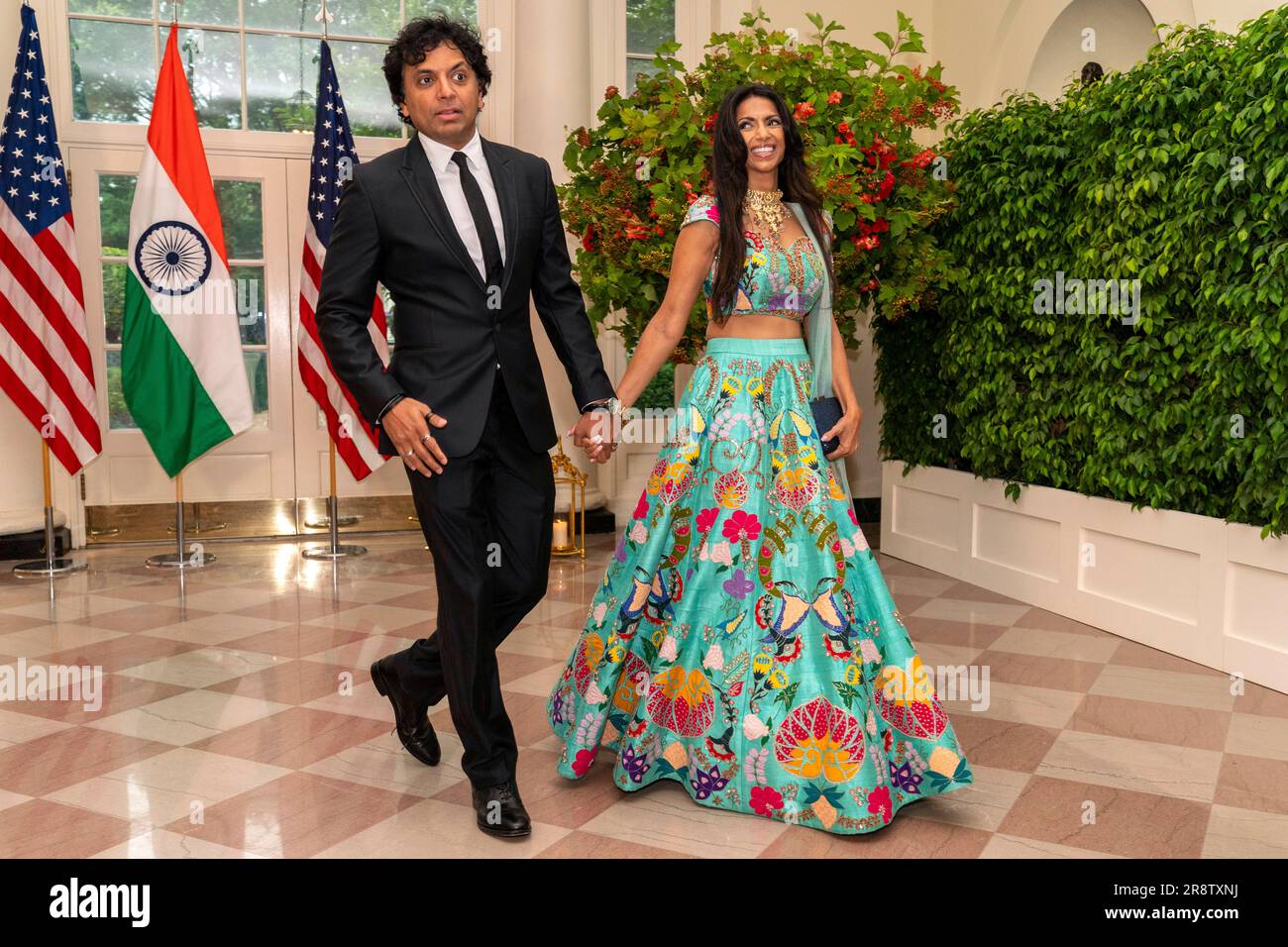 Filmmaker M. Night Shyamalan and his wife Bhavna Shyalaman arrive for ...
