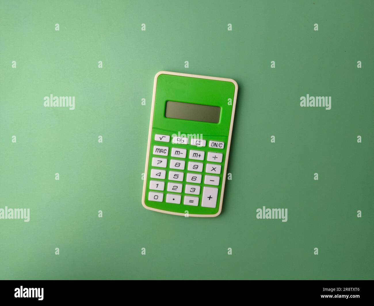 Top view green calculator on a green background. Business concept Stock ...