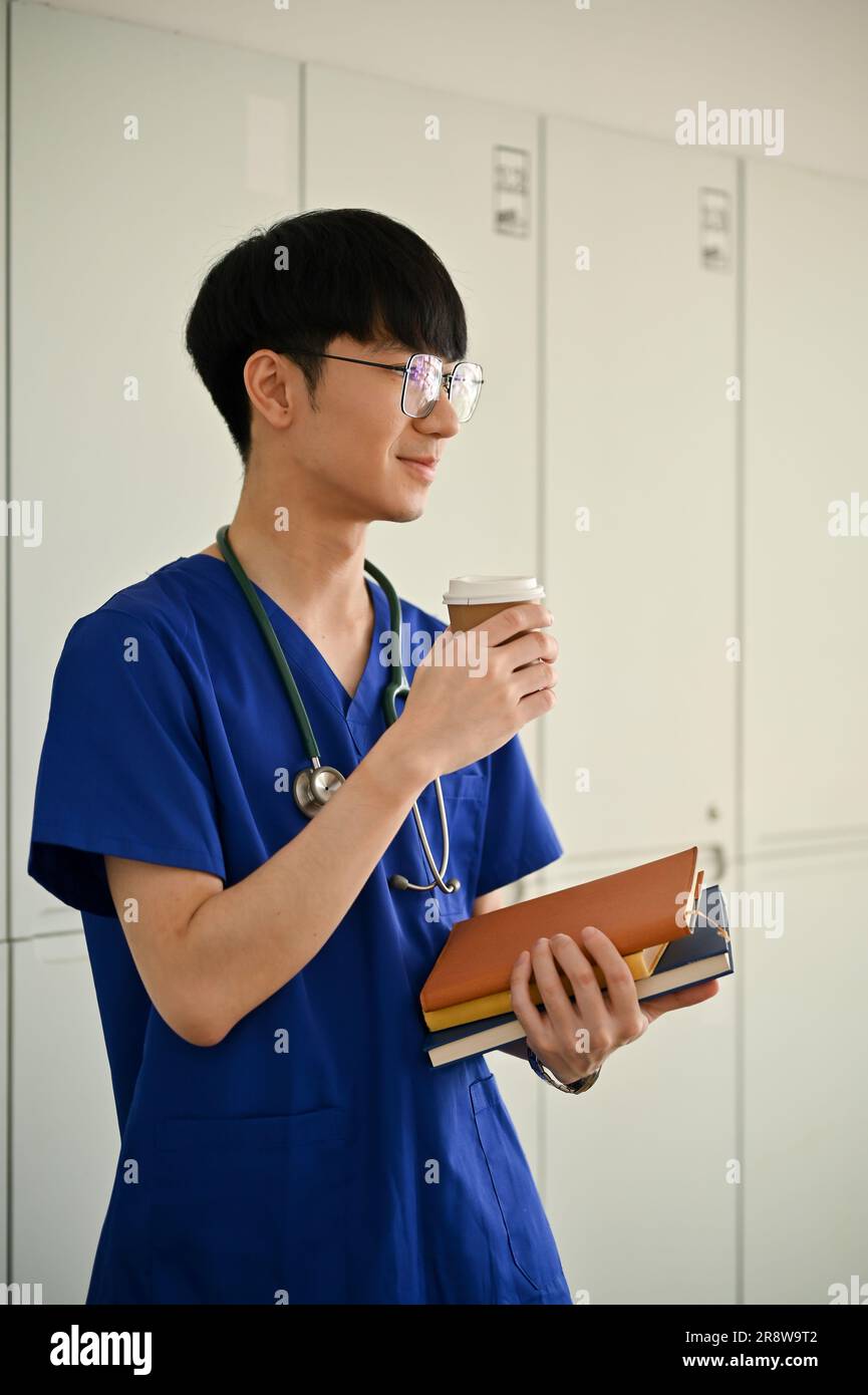 A portrait of a handsome young Asian male medical student or doctor in ...