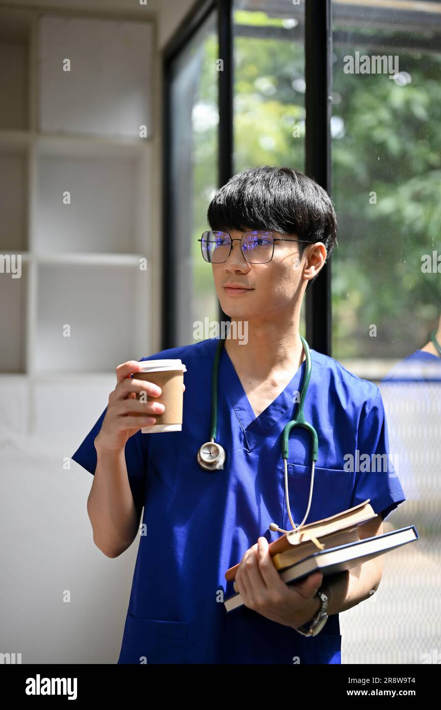 A handsome and smart young Asian male medical student or doctor in ...