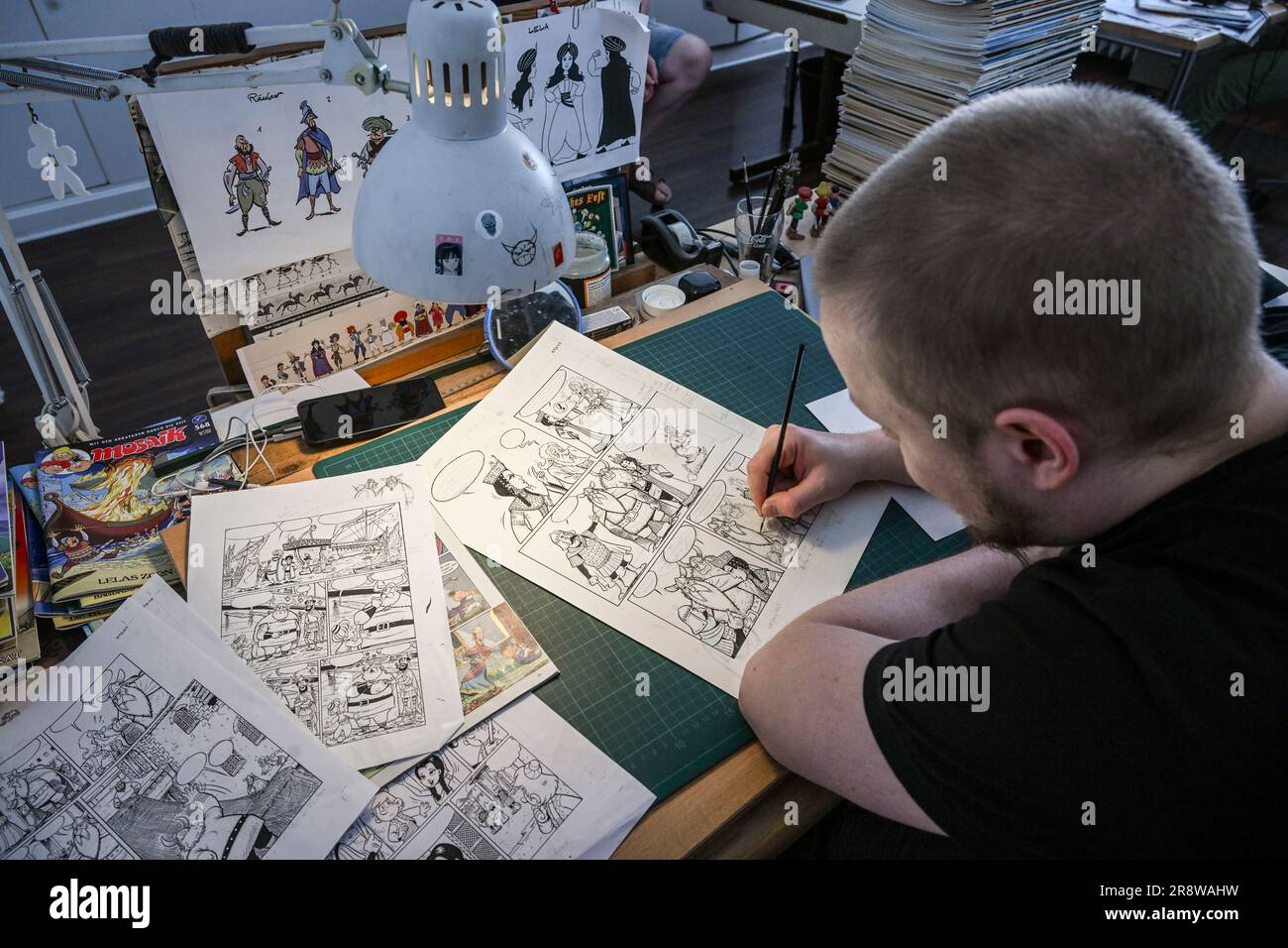Berlin, Germany. 15th June, 2023. Cartoonist Niels Bülow works on the ...