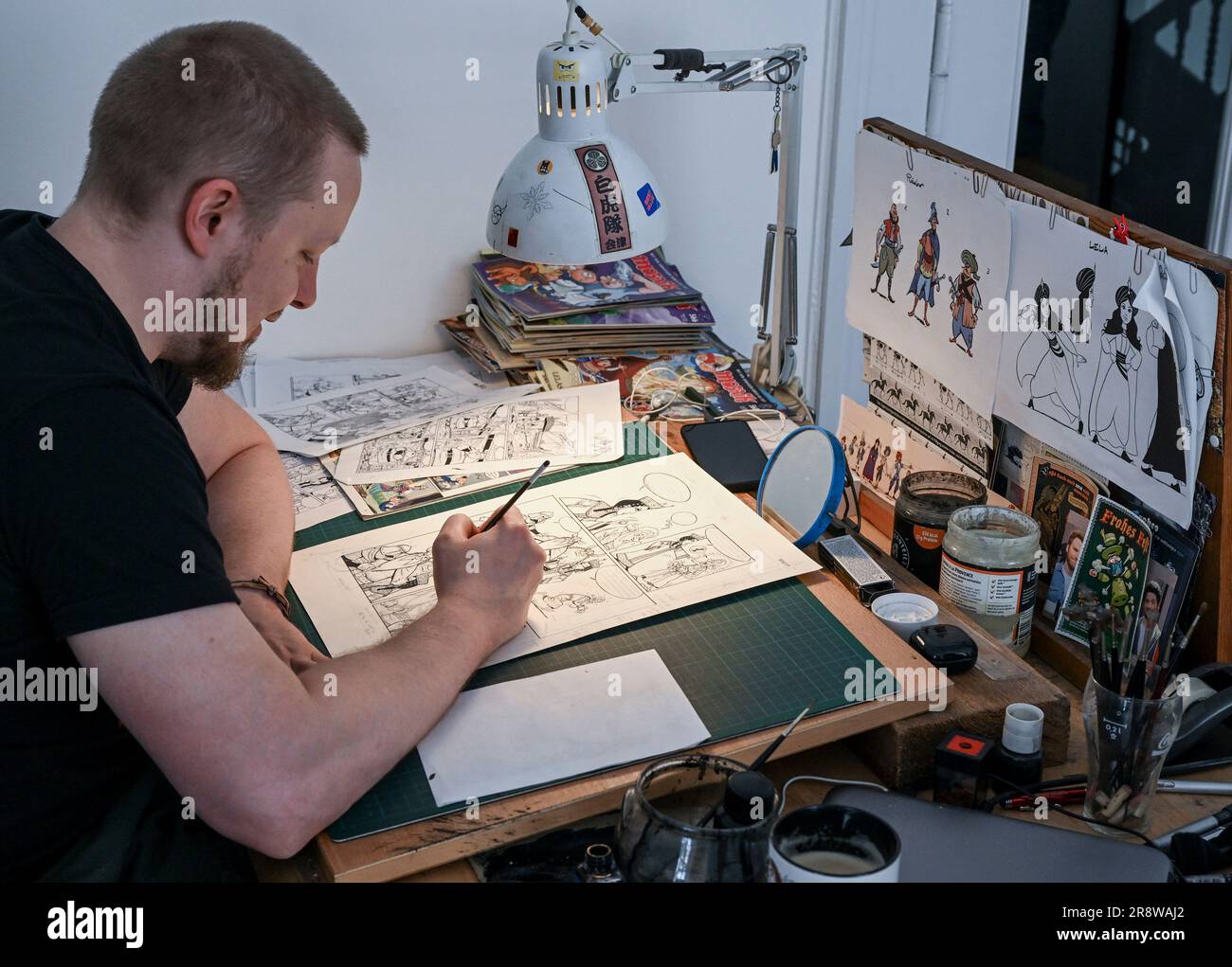Berlin, Germany. 15th June, 2023. Cartoonist Niels Bülow works on the ...