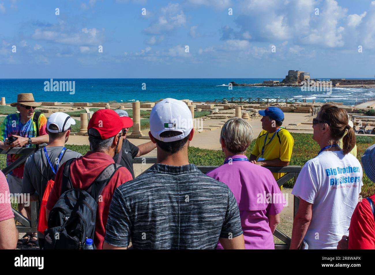 A tour group visits the ancient ruins of Caesarea Maritima in Caesarea ...