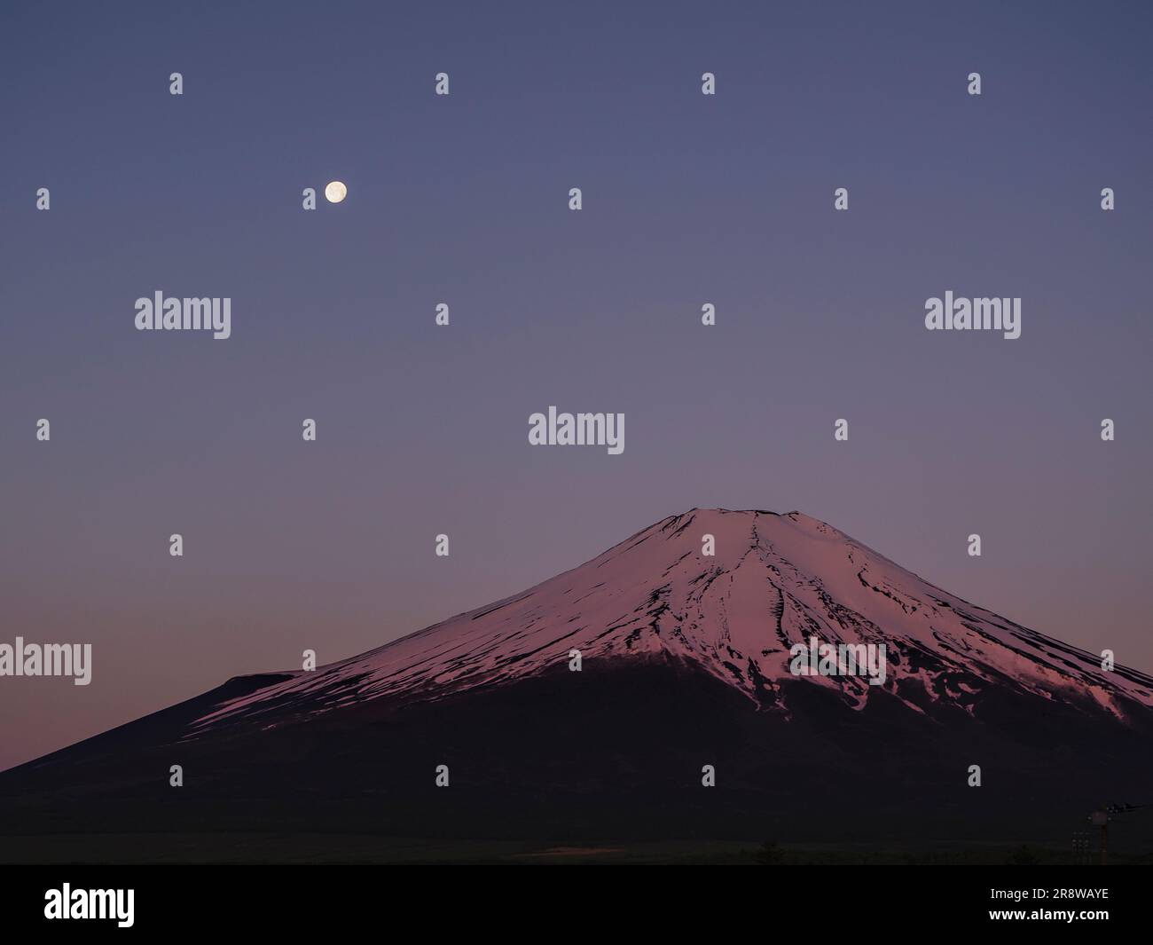Red Mt, Fuji with remaining moon early in the morning Stock Photo - Alamy