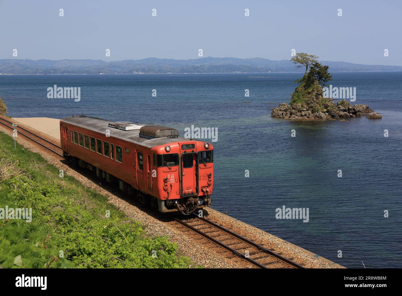 Train of Himi line running along Amaharashi coast Stock Photo - Alamy