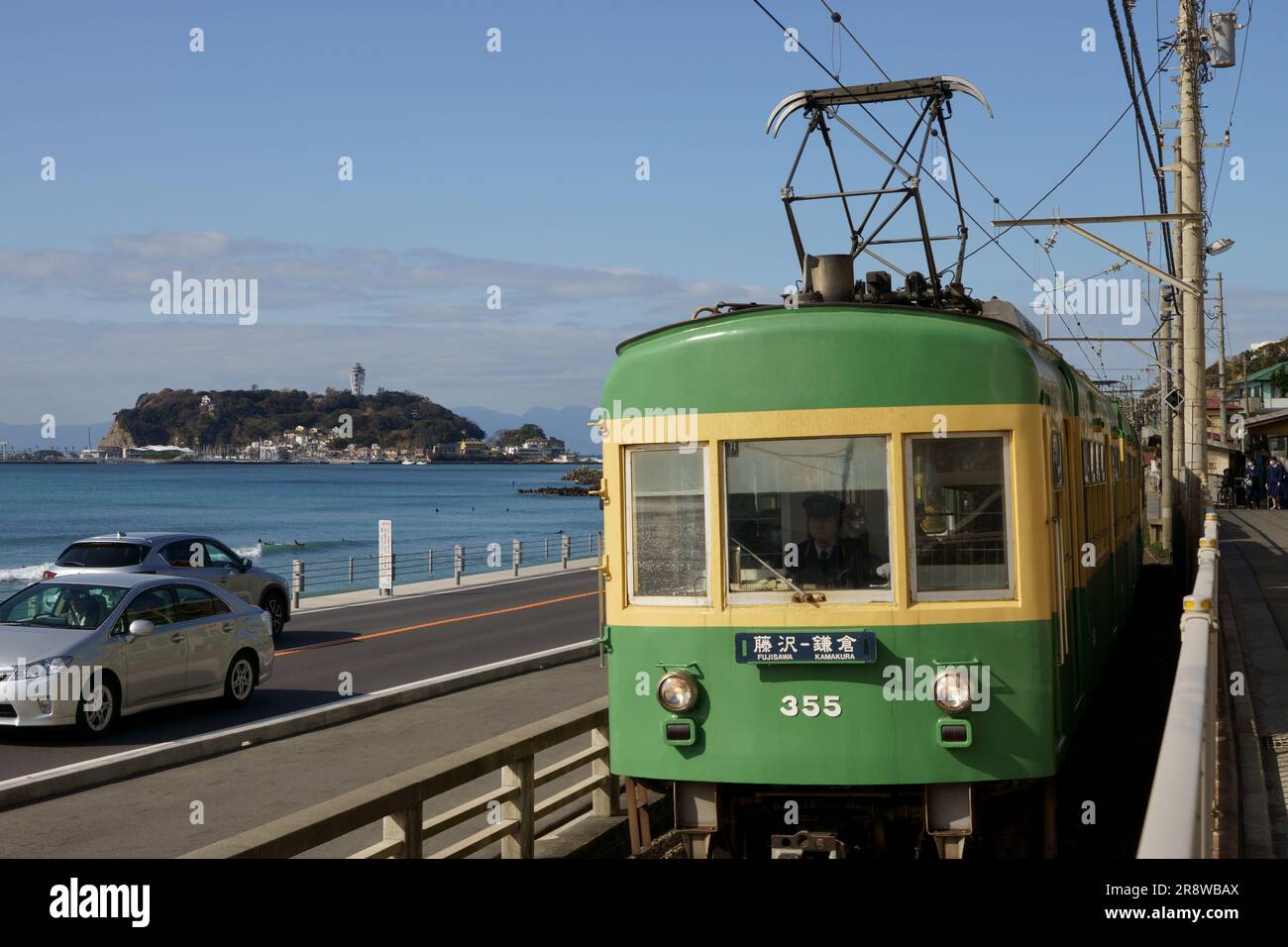 Enoshima Electric Railway Type 300 and Enoshima Island Stock Photo - Alamy