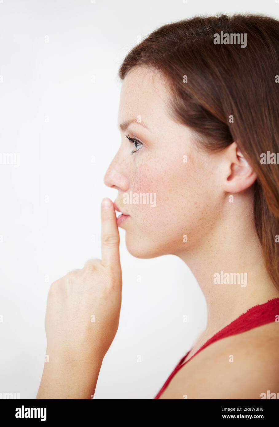 Fingers on lips side profile hi-res stock photography and images - Alamy