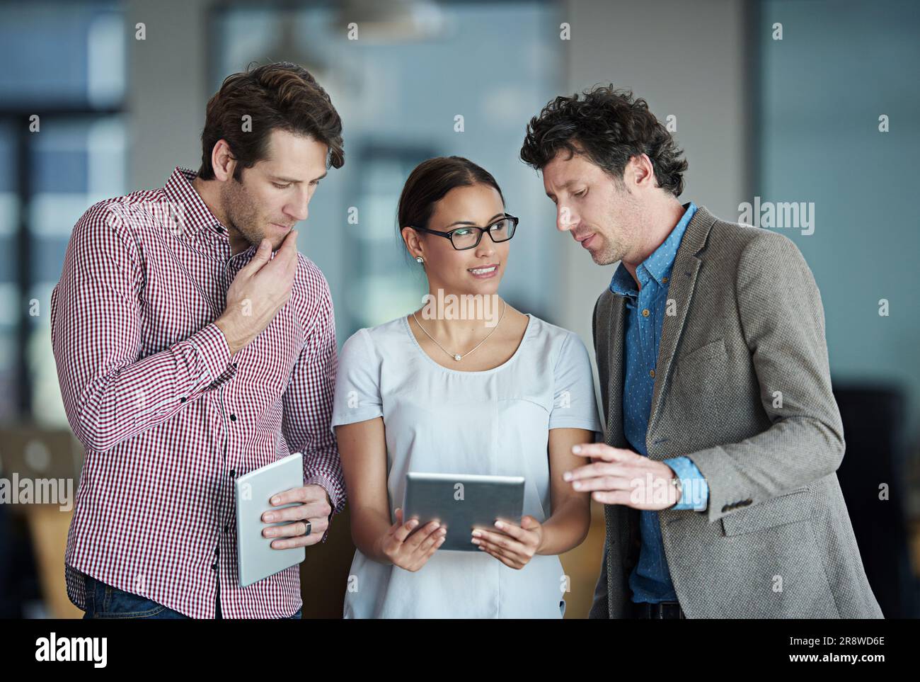 Teamwork, tablet or business people with research talking in meeting for brainstorming together ...