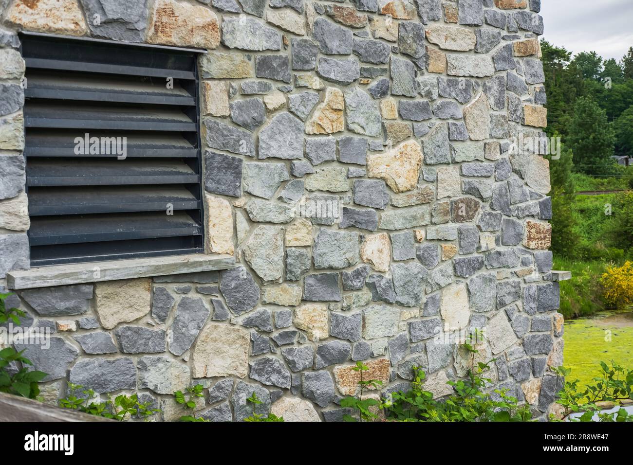 Window of a house closed with black wooden shutters. Old, ancient wood ...