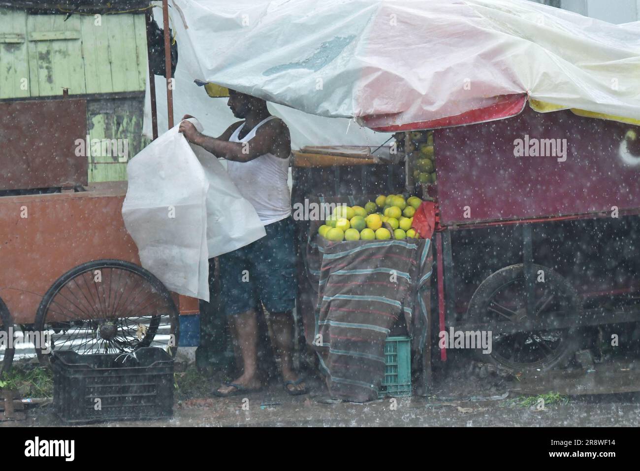 Shopkeepers in rain hi-res stock photography and images - Alamy