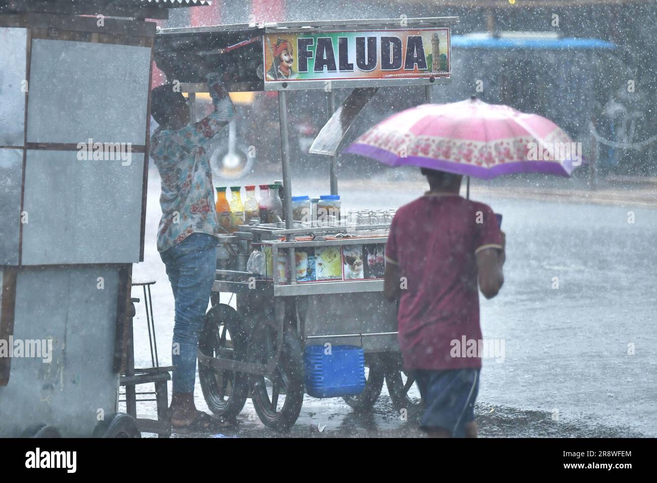 Shopkeepers in rain hi-res stock photography and images - Alamy