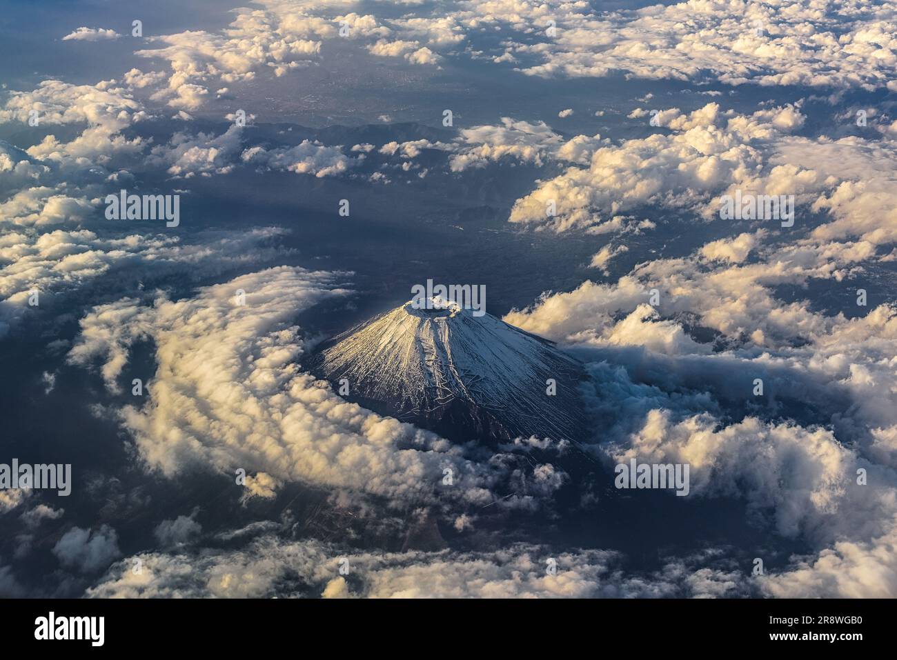 Mountain Fuji with cloud surround shot from aeroplane Stock Photo - Alamy