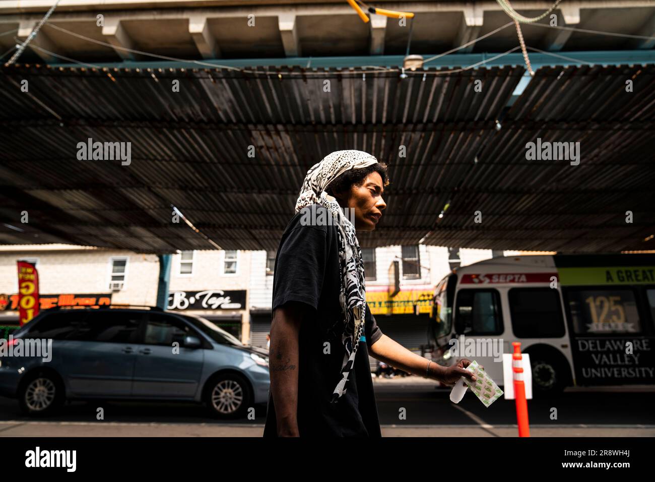 Sharday Miller, walks away holding extra bandages she received after ...