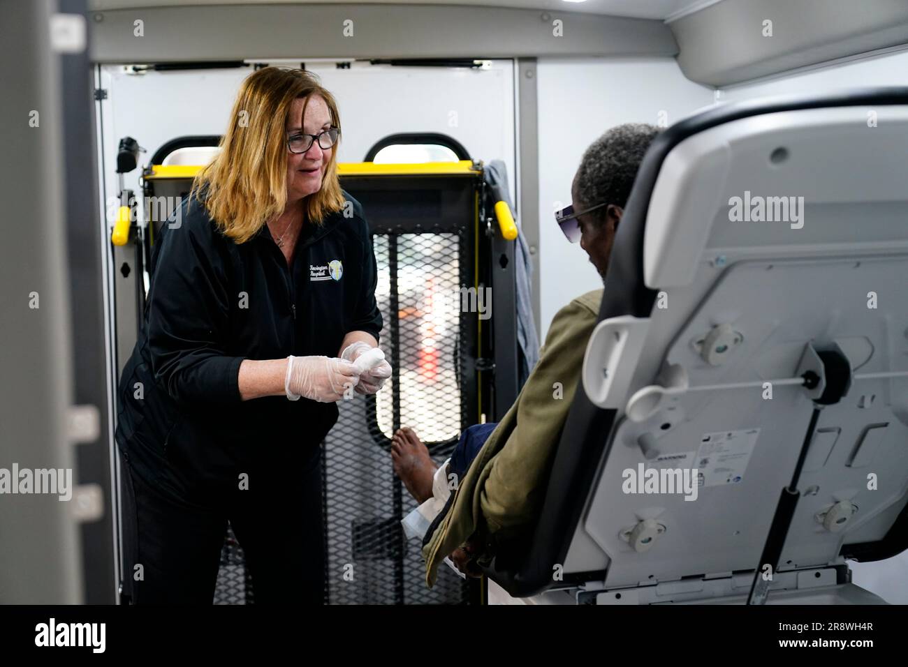 Registered nurse Kathy Lalli treats Darryl Macneil's injury a the ...