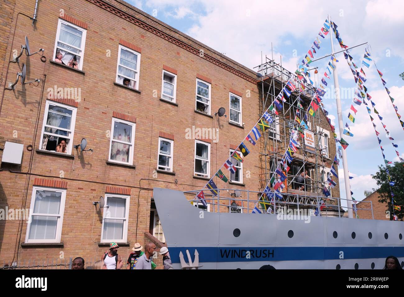 A model of the HMT Windrush leads a parade marking the 75th anniversary ...