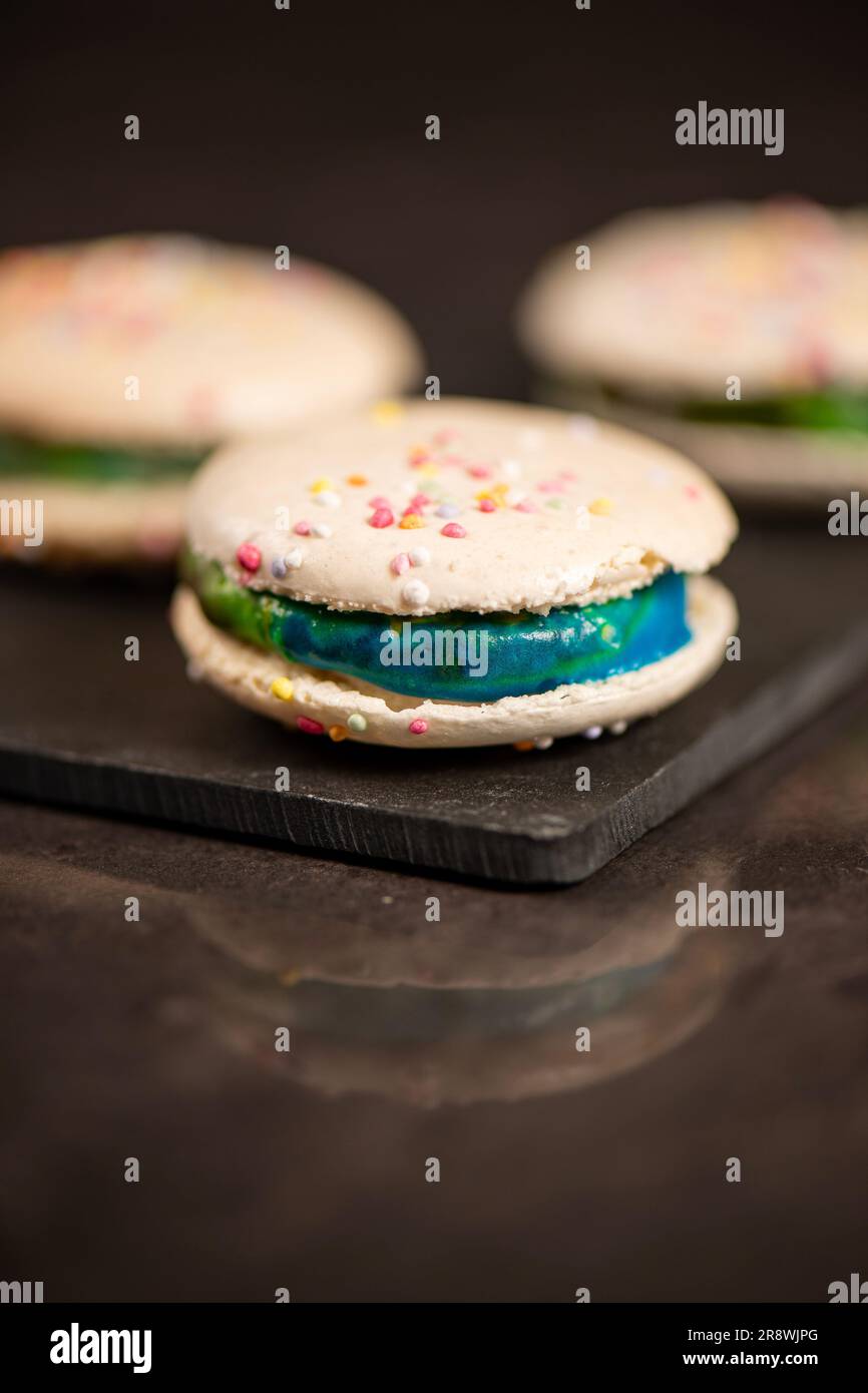 Delicious French sweet vanilla macaron with a velvet rainbow ganache ...