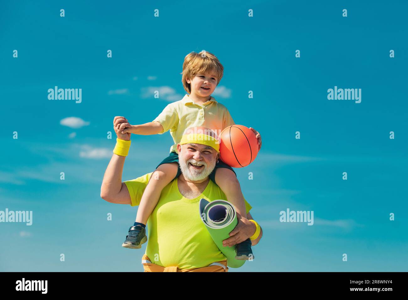Grandpa and grandson spotting. Father and child training together. I ...