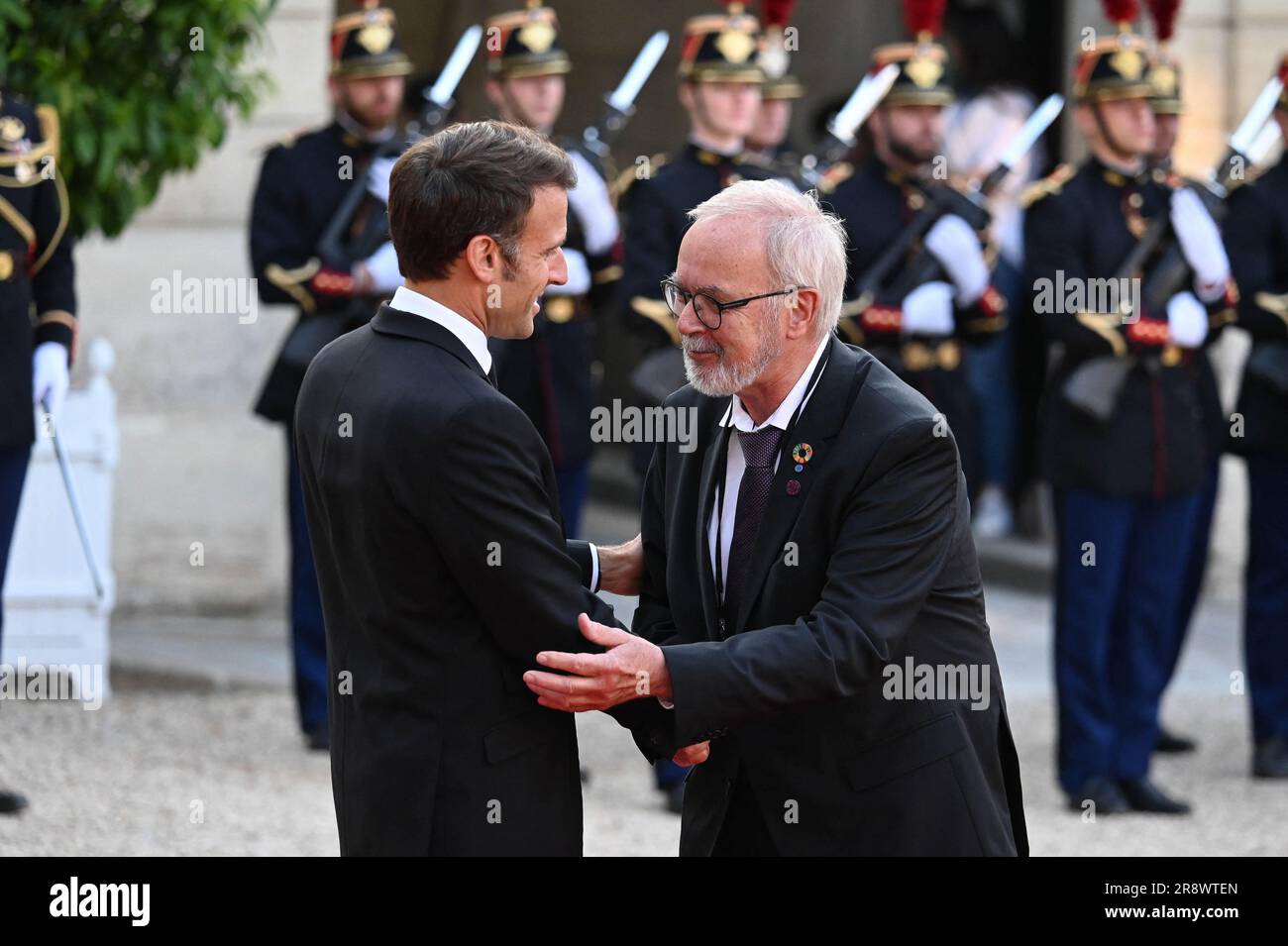 French President Emmanuel Macron and his wife Brigitte Macron greet ...