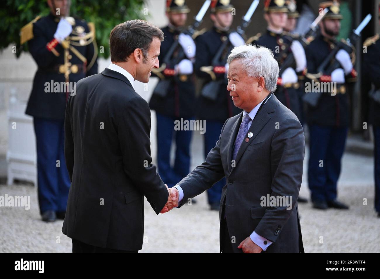 French President Emmanuel Macron and his wife Brigitte Macron greet ...