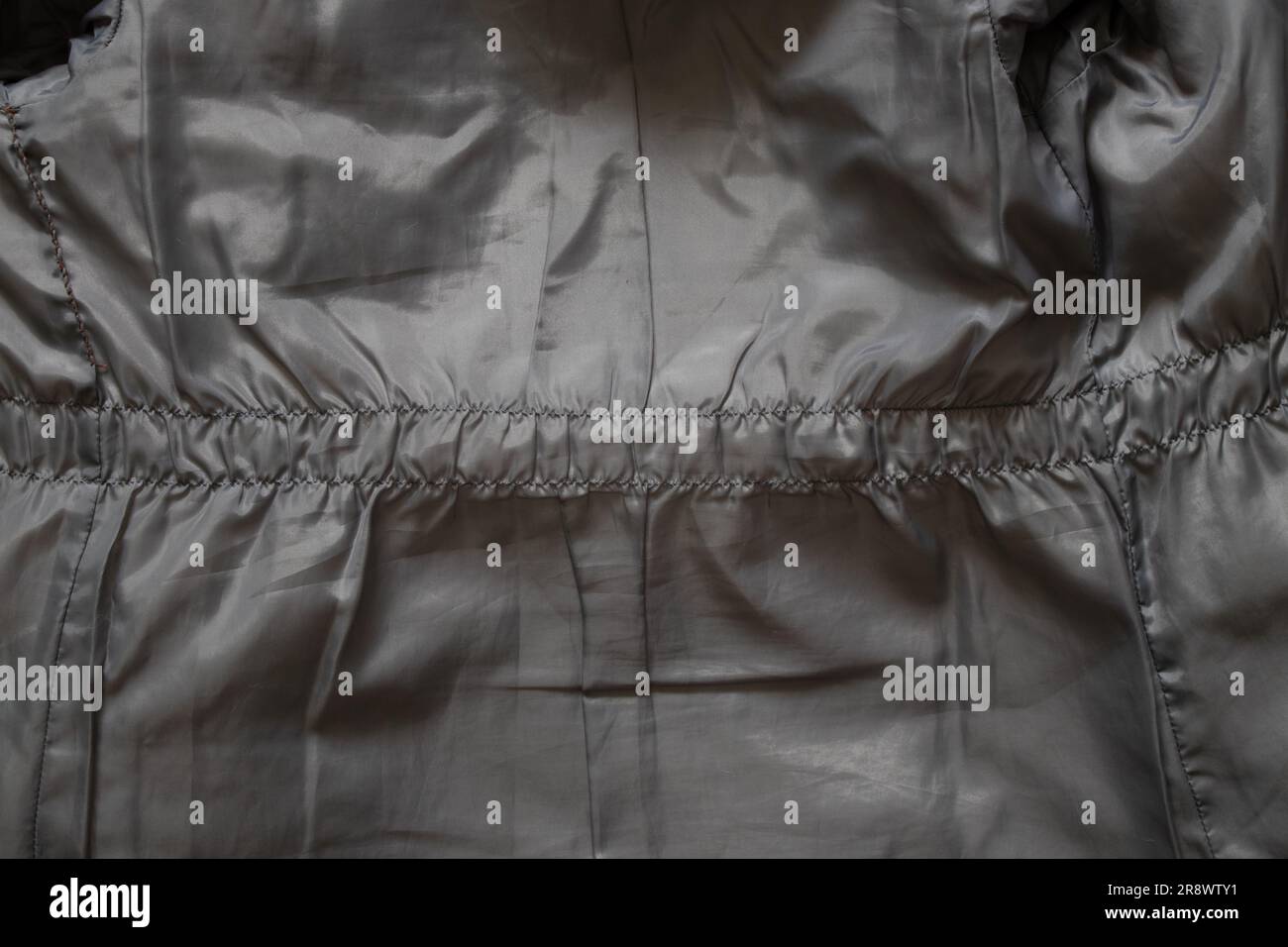 gray wrinkled fabric lining material as background close up Stock Photo ...