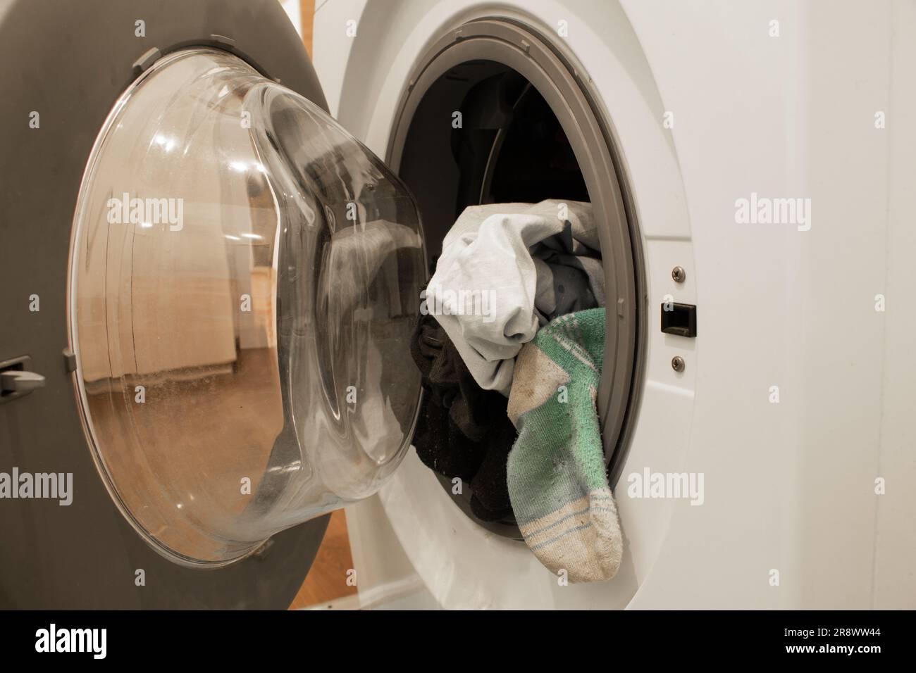 clean things in the washing machine in the bathroom close up Stock ...