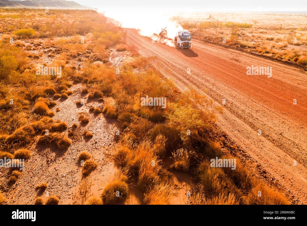 Aerial view of a truck travelling on a dirt road, Pilbara, Western ...