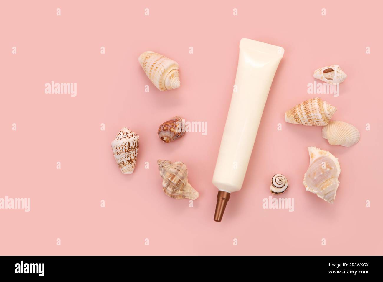 Face and eye cream squeeze cosmetic tube with long nozzle and bronze ...