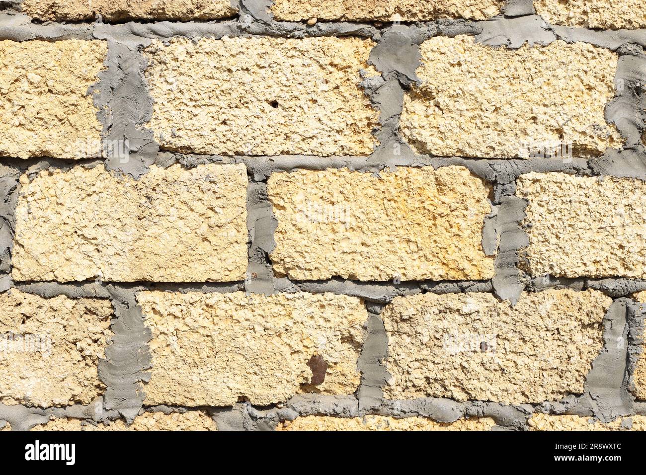 Limestone laid stone bricks with cement background texture. Natural ...