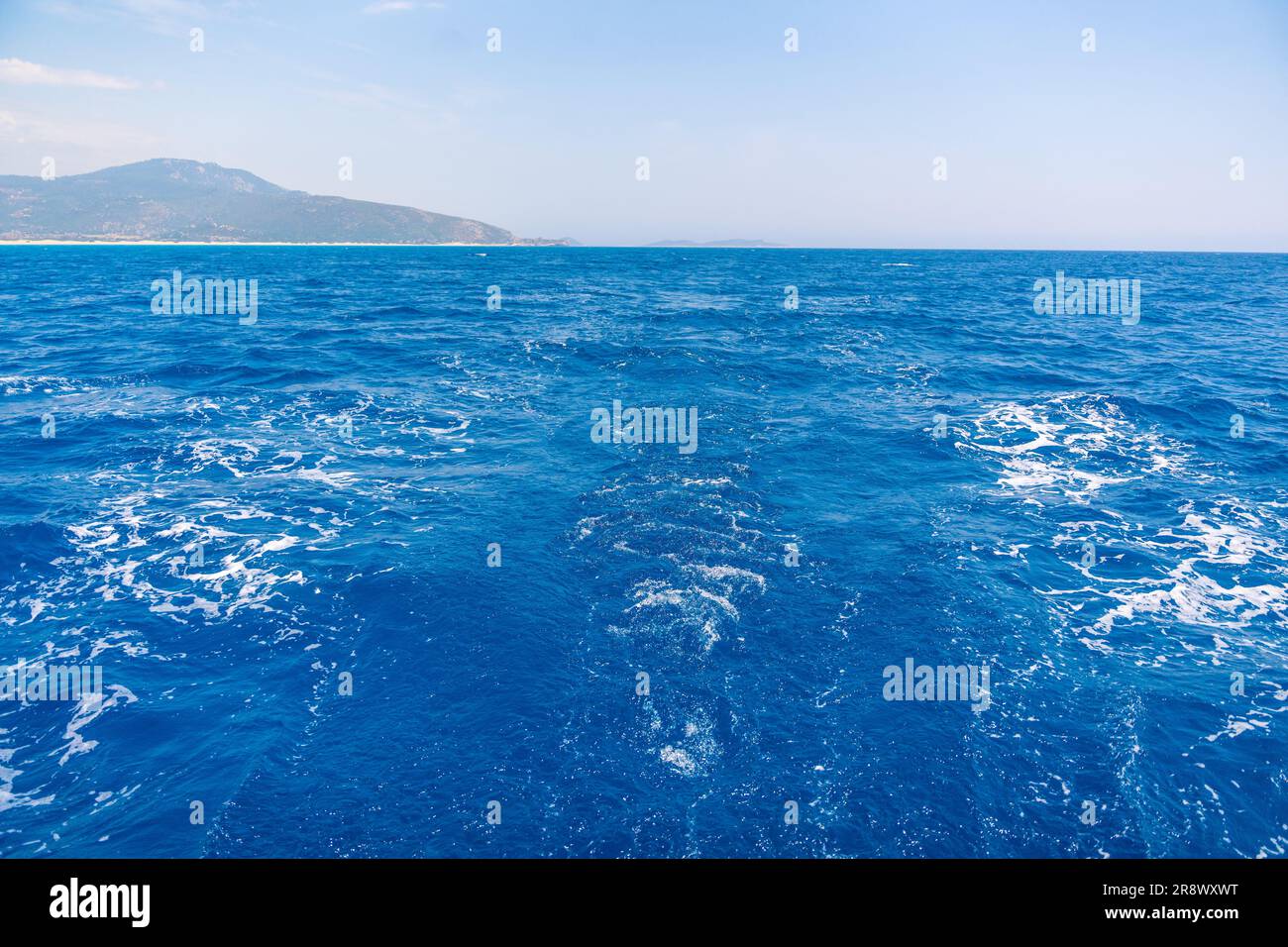 Water surface behind of sailing boat with blue sky Stock Photo - Alamy