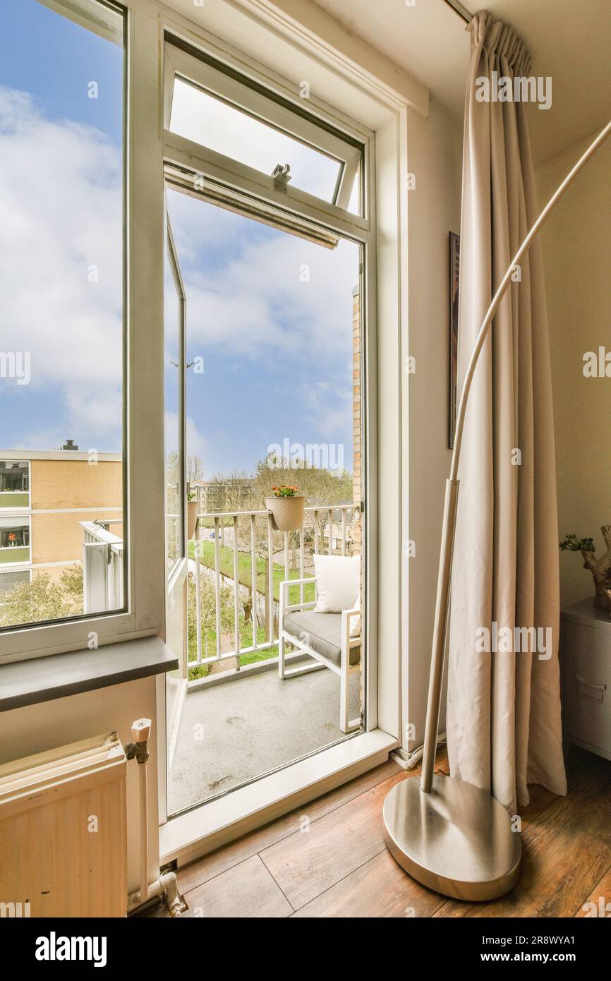 an outside view from inside a room with wood floor and sliding glass ...